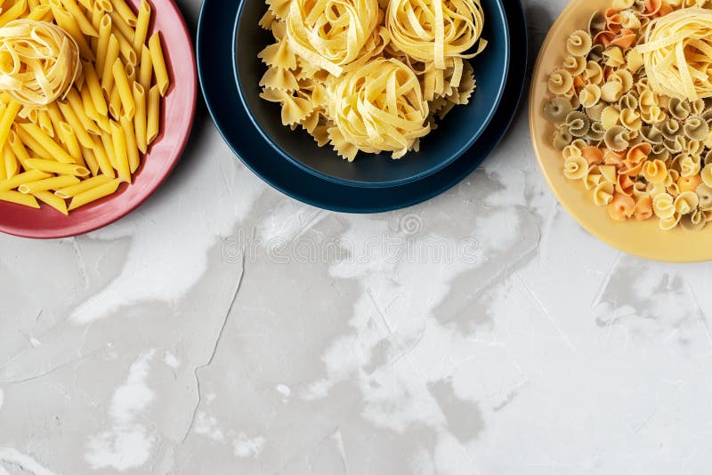 Different Paste in Multicolored Ceramic Dishes on a Background of ...