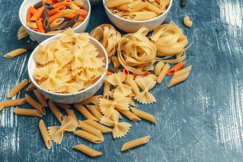 Different Pasta Types in Bowls on the Table. Stock Image - Image of ...