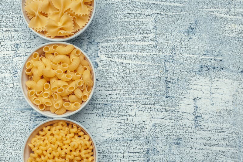 Different Pasta Types in Bowls on the Table. Creative Photo. Stock ...