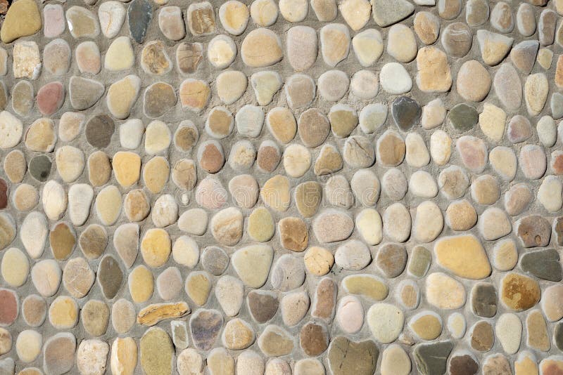 Different pebbles pavement stock photo. Image of natural - 142425124