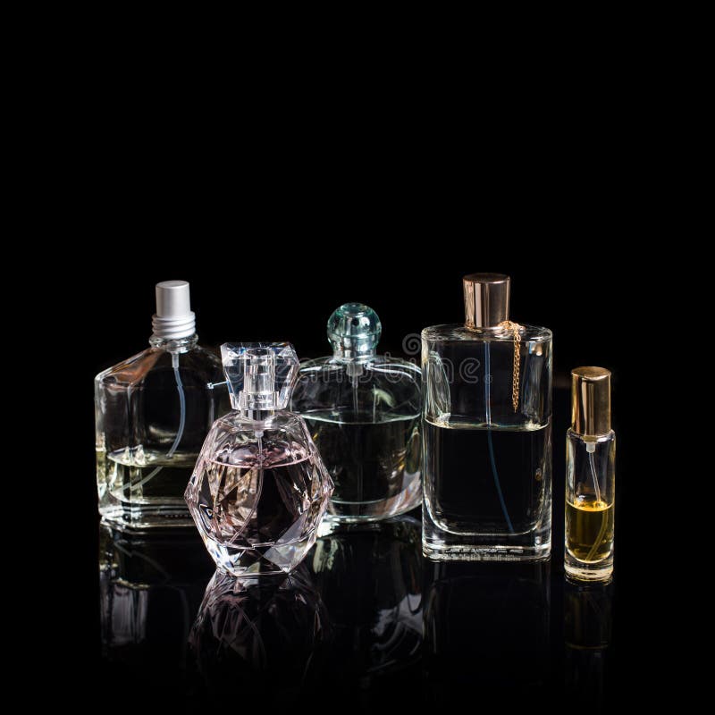 Perfume Bottles with Flowers on Light Background. Perfumery, Cosmetics ...