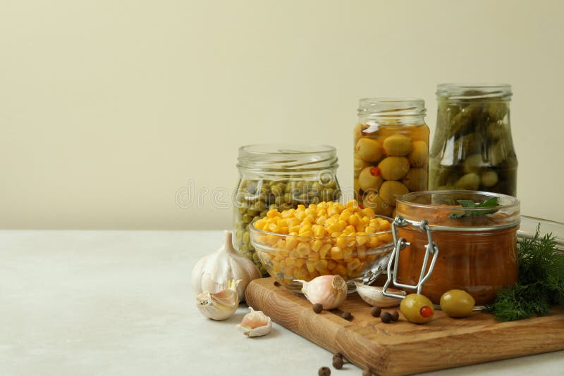 Different Pickled Food and Ingredients on White Textured Table Stock ...