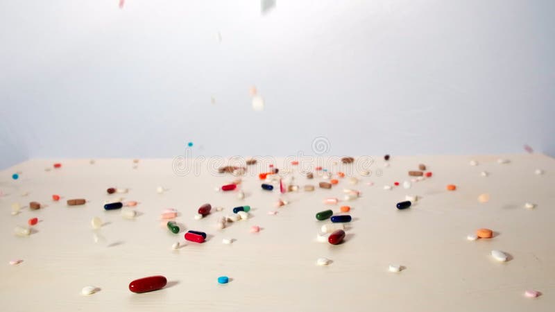 Different Pills Falling on Table. Stock Footage - Video of antibiotic ...
