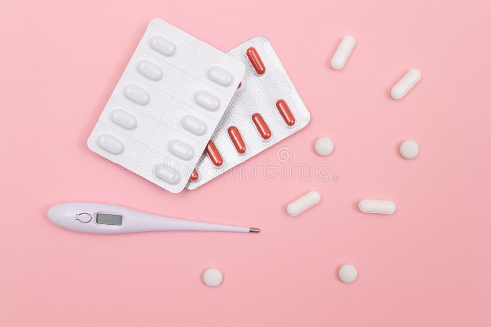 Different Pills and Tablets Package with White Electronic Thermometer ...