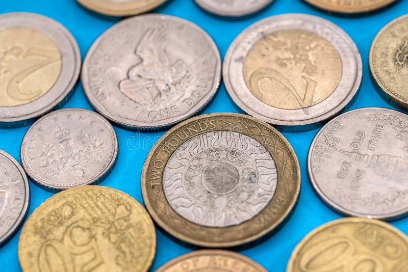 Different Pound Coins on a Blue Stock Photo - Image of blue, coins ...