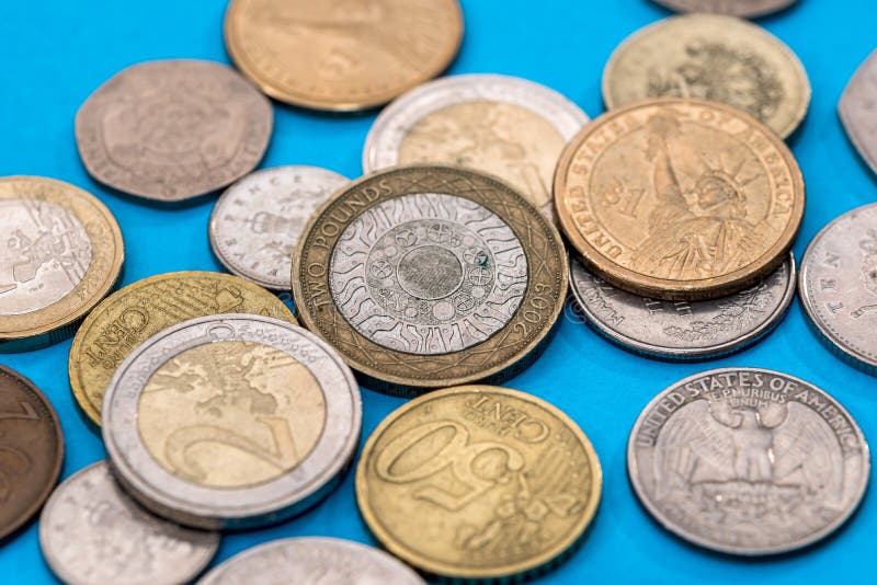 Pound Coins on a Blue Background. Stock Image - Image of background ...