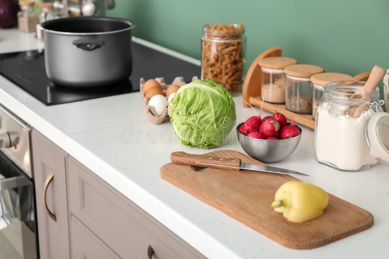 Different Products on Table in Modern Kitchen Stock Image - Image of ...