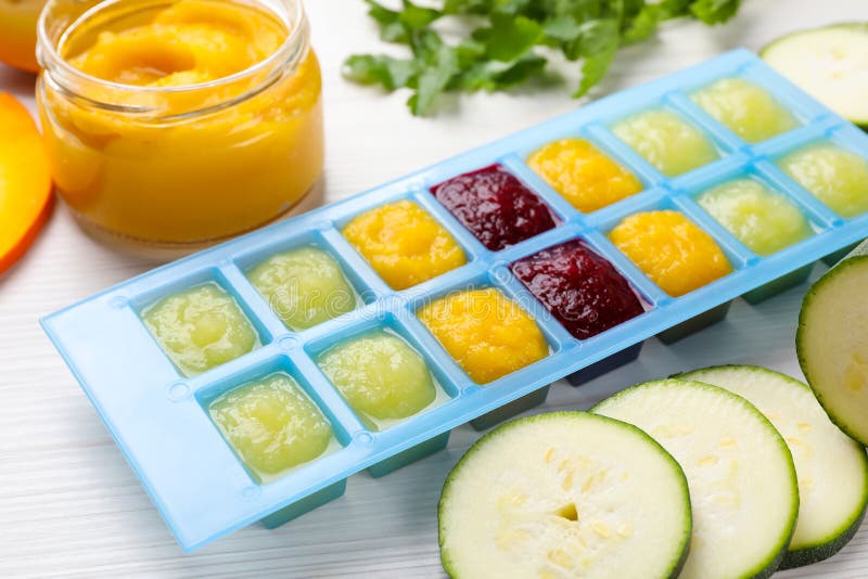 Different Purees in Ice Cube Tray and Ingredients on White Table. Ready ...