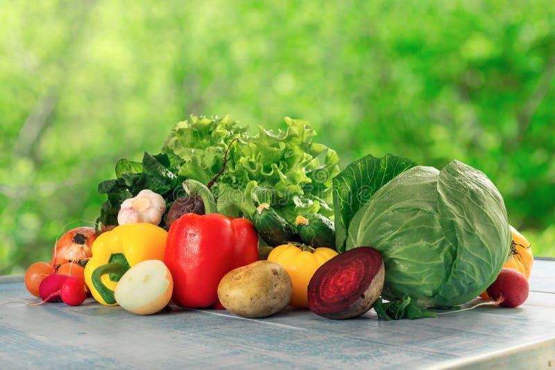 Different Raw Fresh Vegetables Ð¾n Blue Rustic Wooden Table Stock Image ...