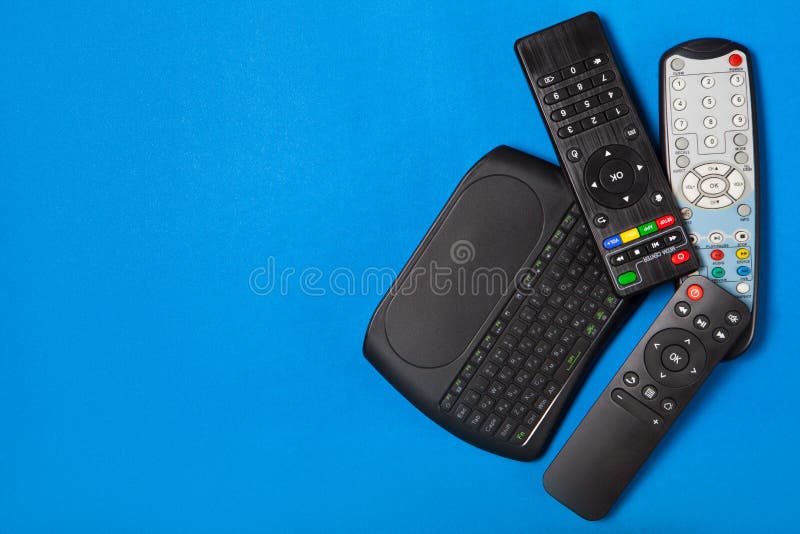 Different Remote Control on Blue Background with Place for Text Stock ...