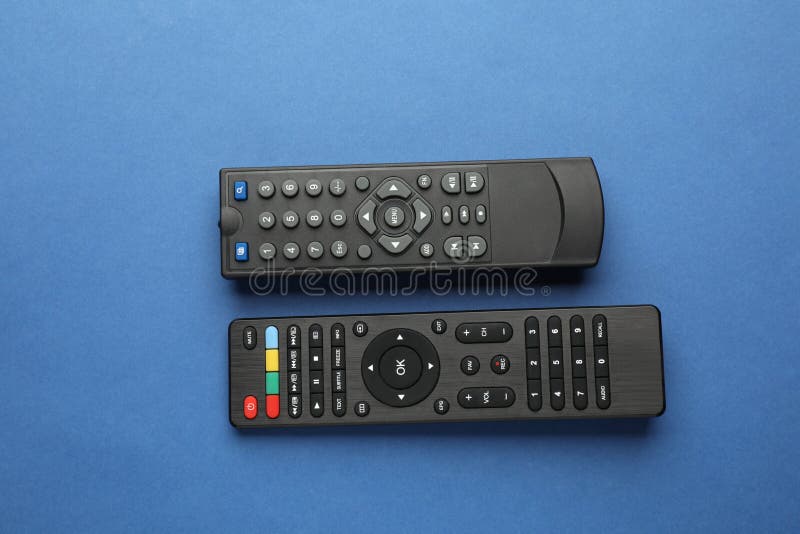 Different Remote Controls on Blue Background, Flat Lay Stock Photo ...