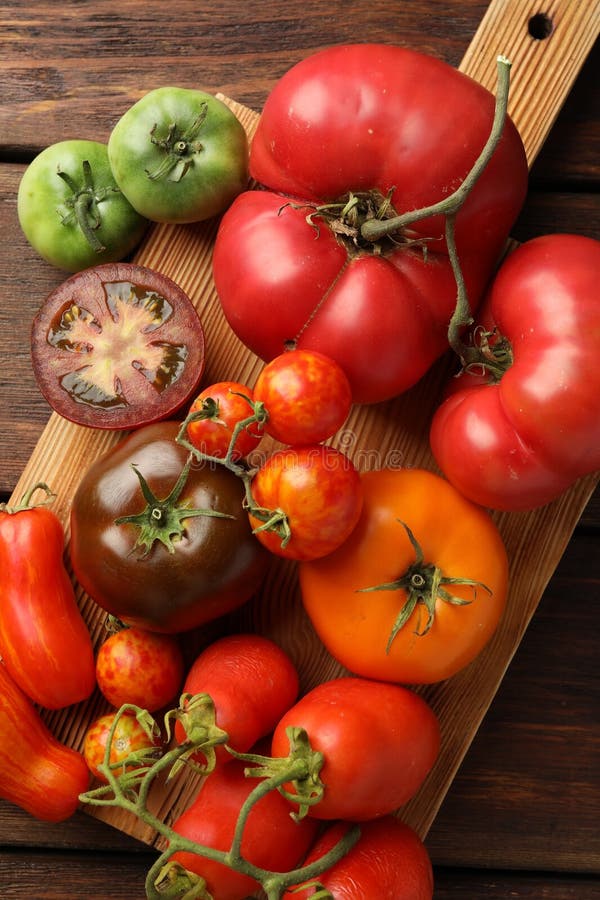 Different Ripe Tomatoes on Wooden Table, Top View Stock Photo - Image ...