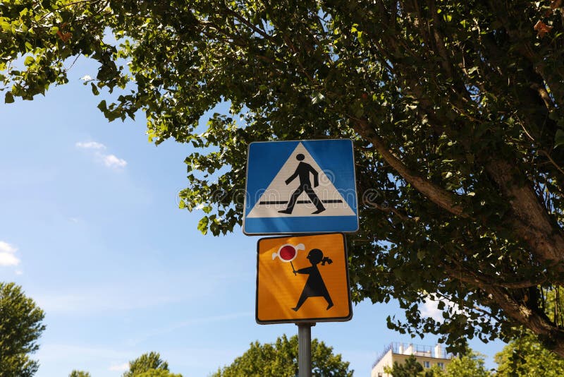 Different Road Signs Near Tree Outdoors on Sunny Day Stock Image ...