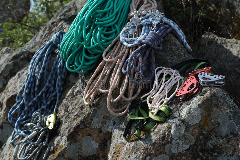 Different Ropes and Other Climbing Equipment on Rocks Outdoors Stock ...