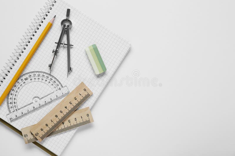 Different Rulers, Compass, Pencil and Notebook on White Background, Top ...