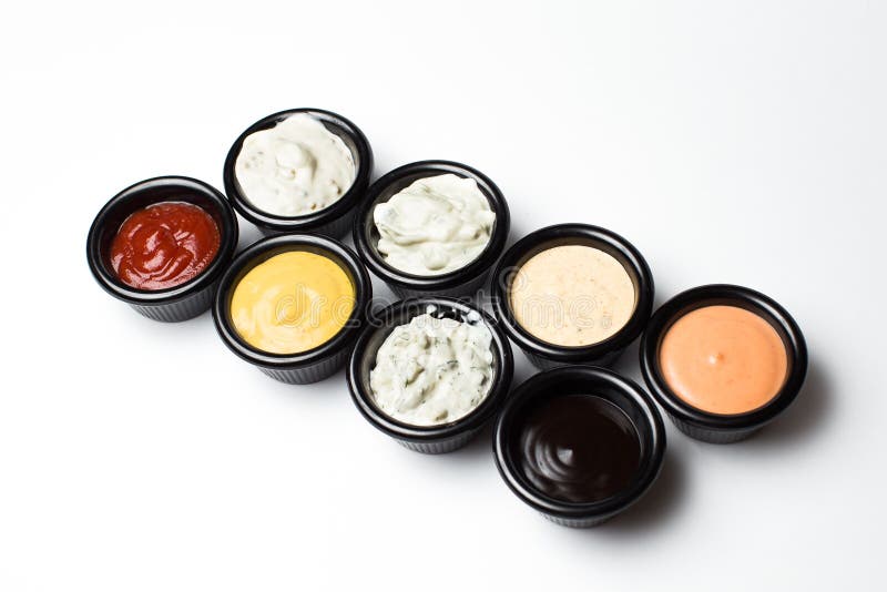 Different Sauces in Assortment in an Black Sauces Stock Photo - Image ...