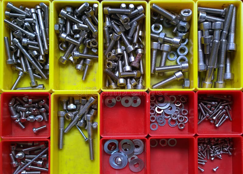 Different Screws in Separated Red and Yellow Plastic Boxes Stock Photo ...