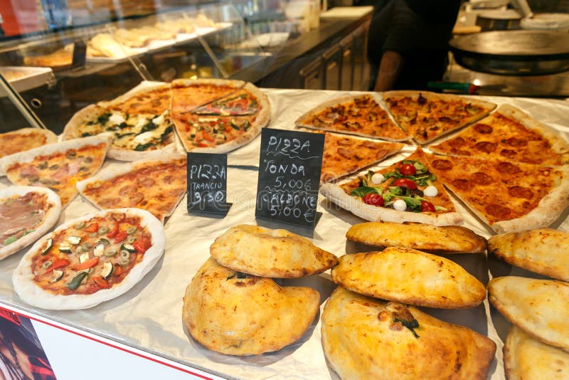 Different See Pizzas on Display in an Italian Store or Bar Stock Photo ...