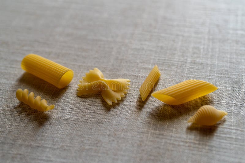 Different Shapes Dry Pasta on Table Stock Photo - Image of closeup ...