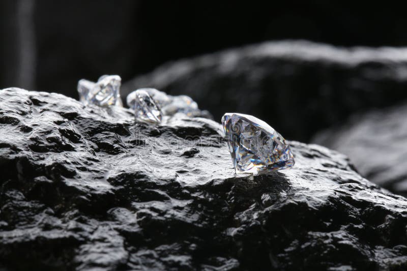 Different Shiny Diamonds on Wet Stone Surface Stock Image - Image of ...