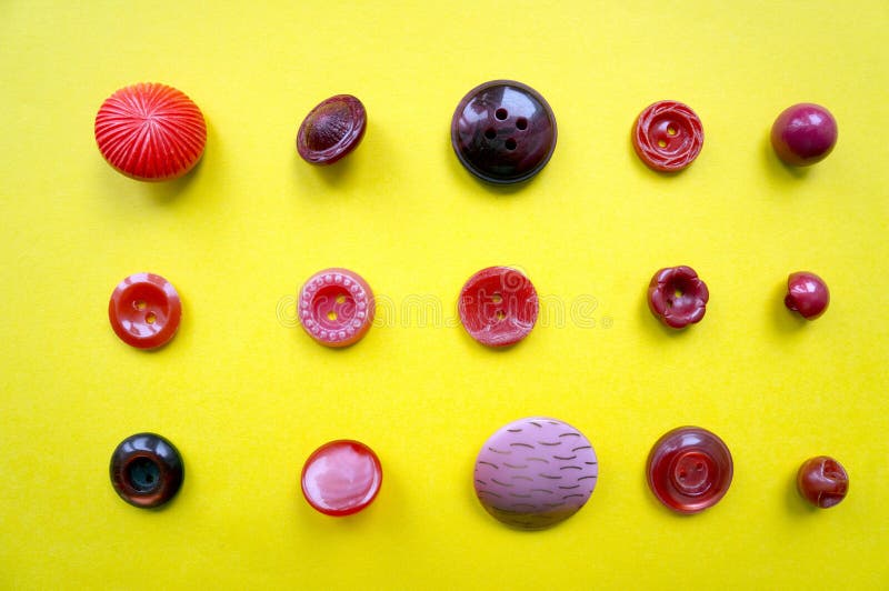 Different Size and Design Red Buttons on a Yellow Background Stock ...