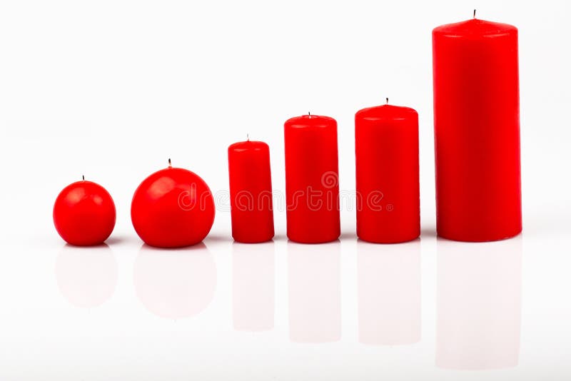 Different Sized Candles on a White Background Stock Photo - Image of ...