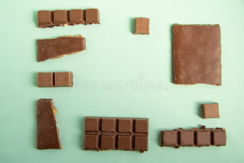 Different-sized Chocolate Bars are Lined with Green Backgrounds in ...