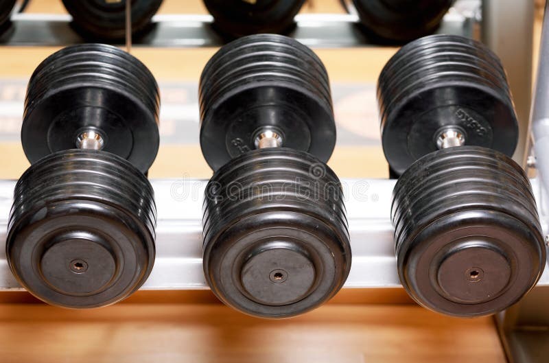 Different Sizes and Weights of Dumbbell Free Weights at a Gym. Stock ...
