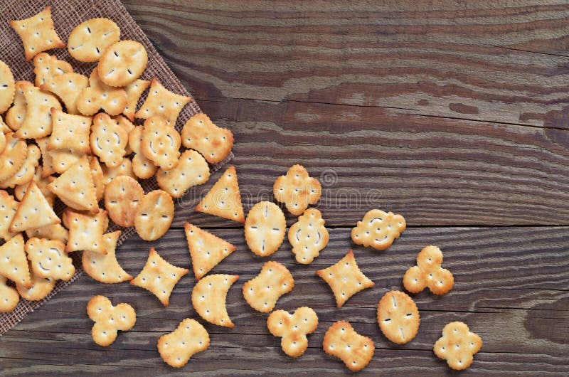 Small Crackers, White Cup with Baked Milk in Plate on Wooden Table ...
