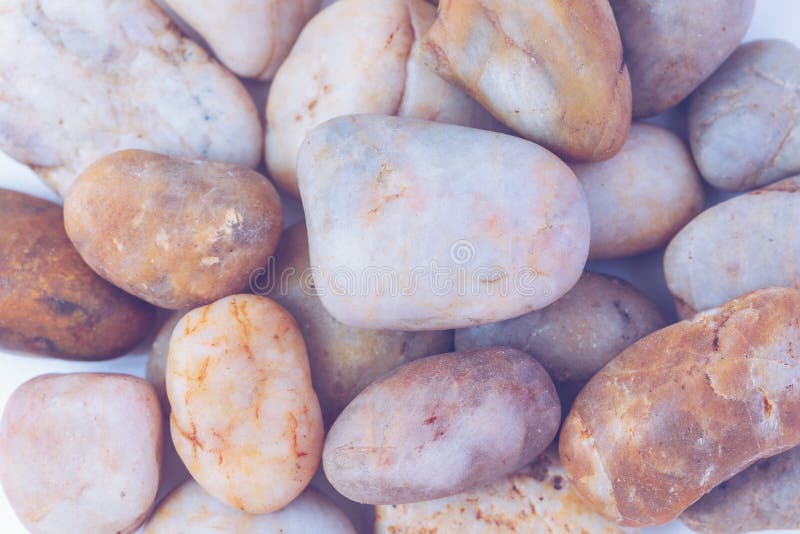 Different Smooth Sea Stones on the Beach Sand . Sea Pebbles Closeup ...