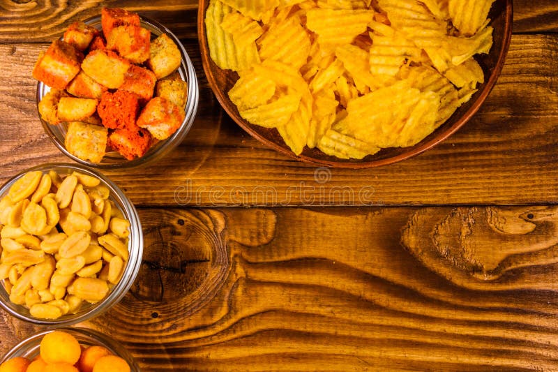Different Snacks for Beer on Wooden Table. Top View Stock Photo - Image ...