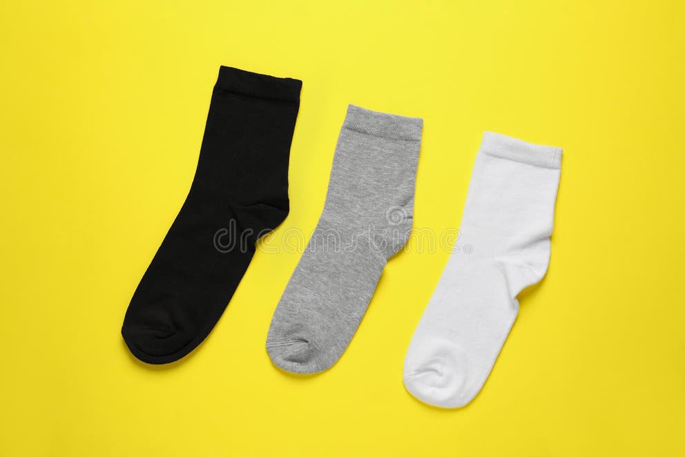 Different Socks on Yellow Background, Flat Lay Stock Photo - Image of ...