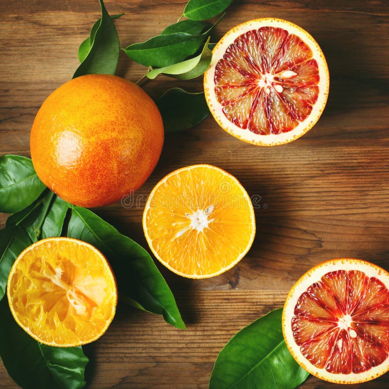 Different Sort of Orange Fruit on Wooden Table Stock Photo - Image of ...