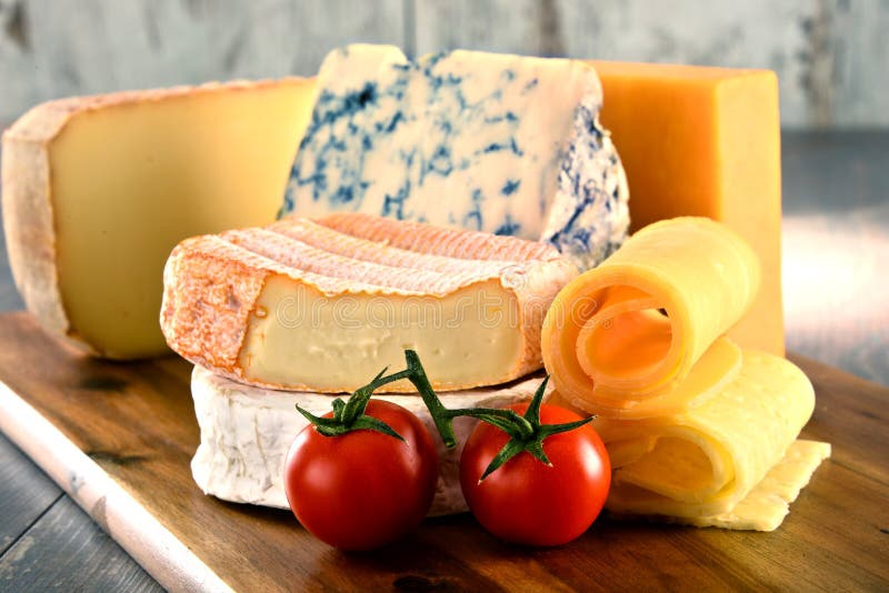 Different Sorts of Cheese Isolated on Kitchen Table Stock Image - Image ...