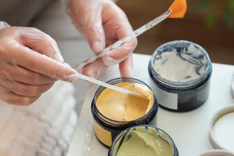 Different Spa Masks Standing on the Table, Hands of a Professional ...