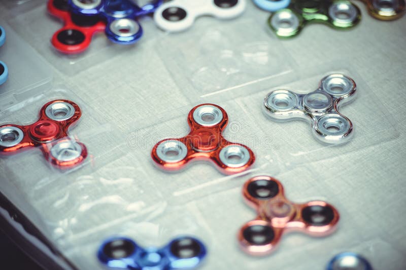 Different Spinners Lie on the Table, Sale Stock Photo - Image of ...