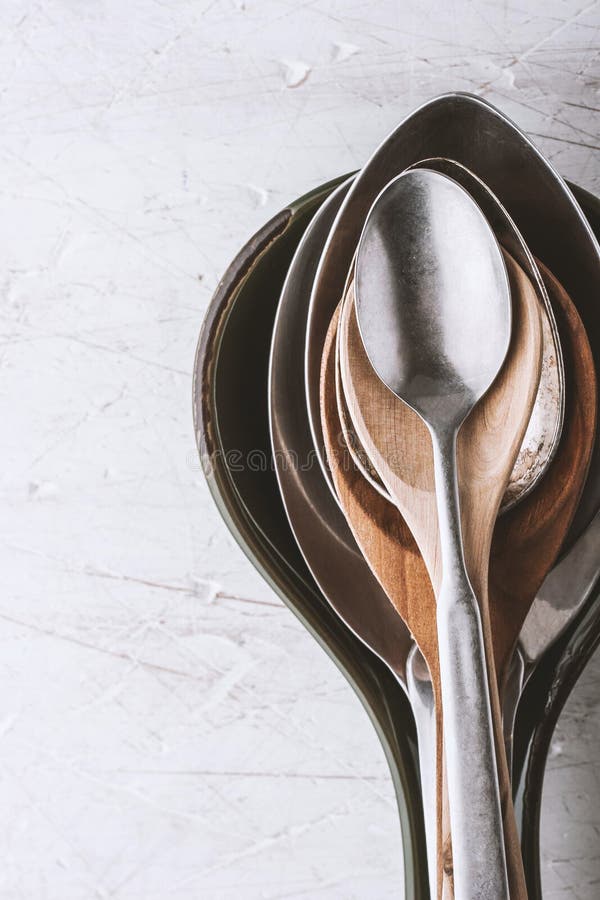 Different Spoons on the White Table Vertical Stock Image - Image of ...