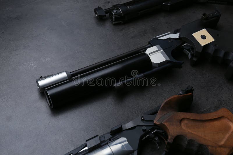 Different Sport Pistols on Black Table. Professional Guns Stock Photo ...