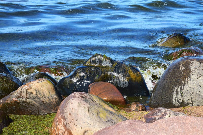 Different Stones on the Seaside with Water in the Background Stock ...