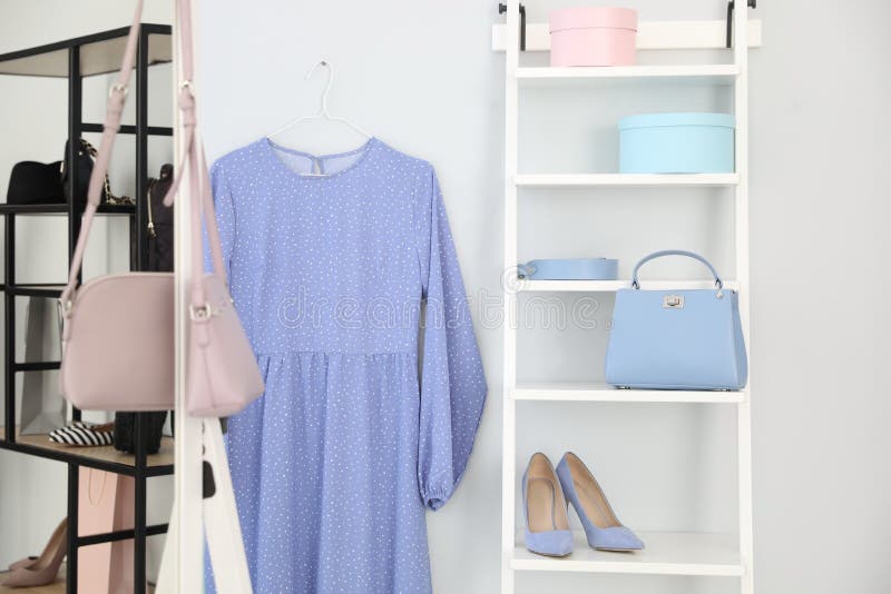 Different Stylish Clothes Hanging on Rack Indoors Stock Image - Image ...