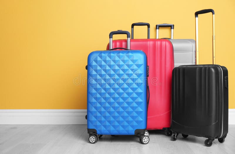 Different Suitcases Near Wall Stock Photo - Image of pack, touristic ...