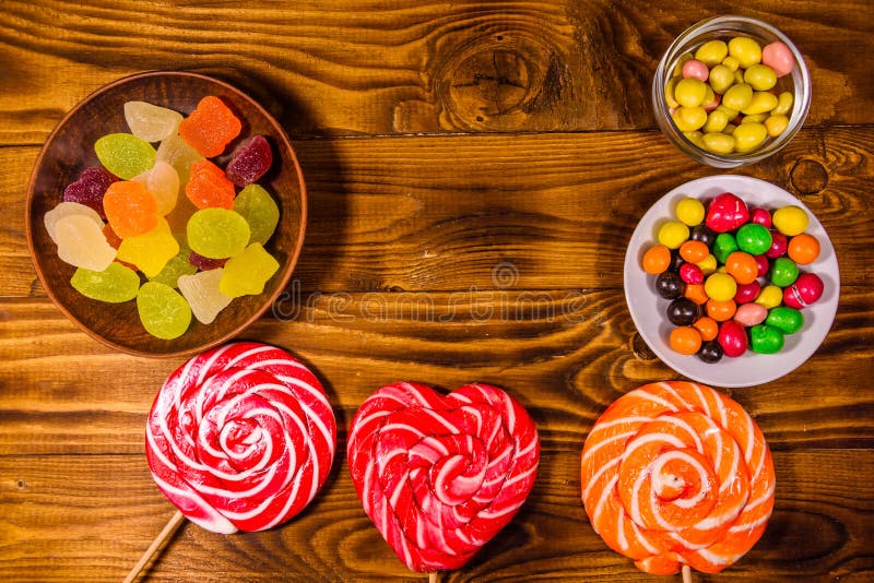 Different Sweet Candies on a Wooden Table. Top View Stock Image - Image ...