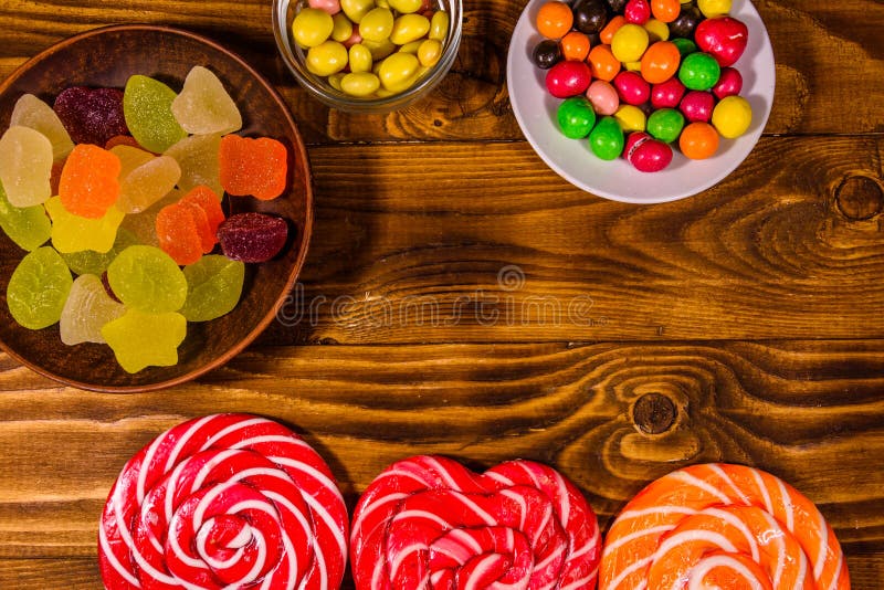 Different Sweet Candies on a Wooden Table. Top View Stock Photo - Image ...