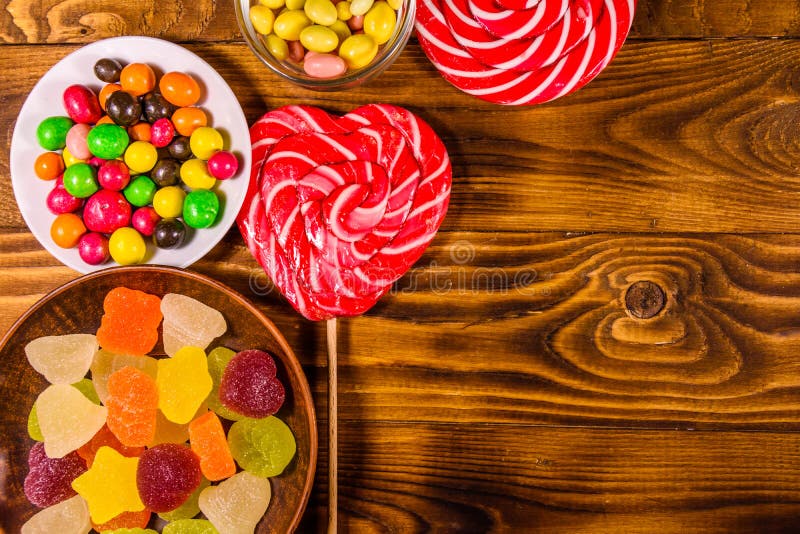 Different Sweet Candies on a Wooden Table. Top View Stock Photo - Image ...