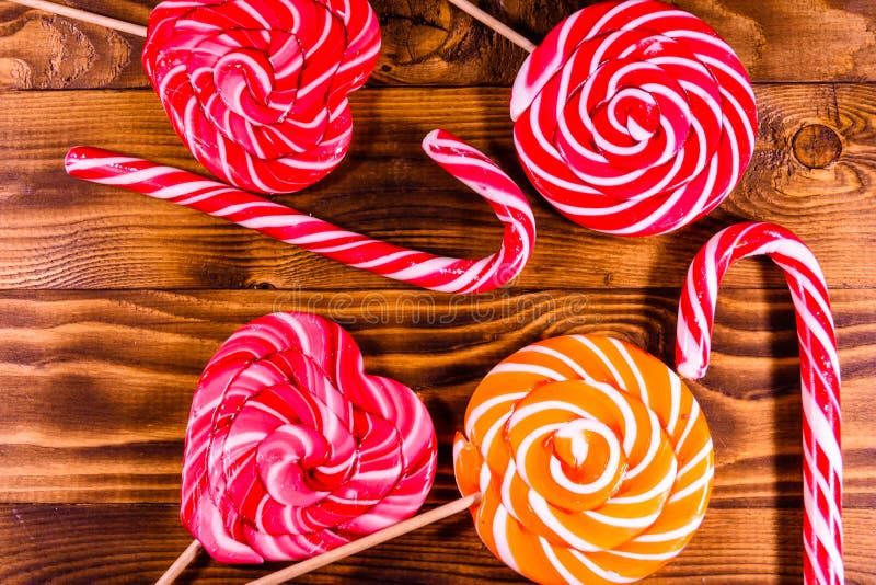 Different Sweet Lollipops on a Wooden Table. Top View Stock Photo ...