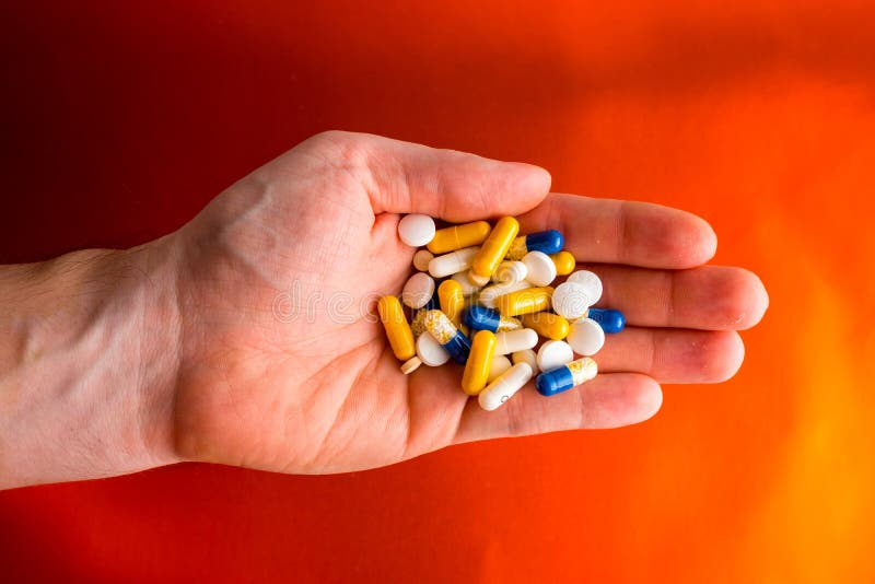 Different Tablets, Pills in Hand, Medications Drugs on Bronze ...