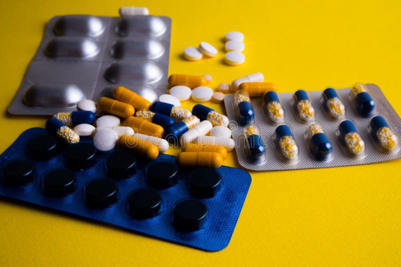 Different Tablets, Pills, Medications Drugs on Yellow Background Stock ...