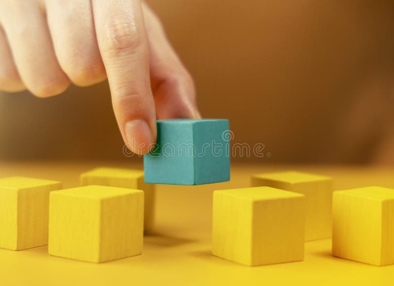 Different, Talent and Outstanding Concept. Hand Picking a Unique Cube ...