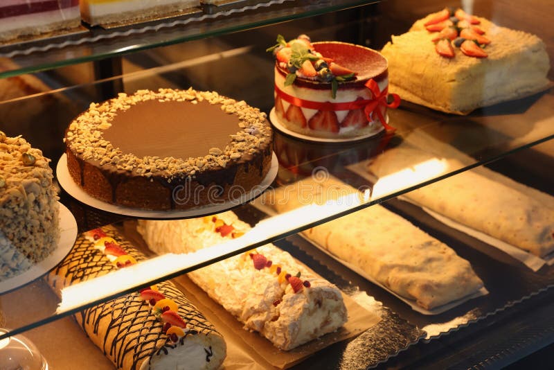 Different Tasty Desserts on Counter in Bakery Shop, Closeup Stock Photo ...