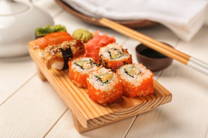 Different Tasty Sushi on Wooden Stand Stock Image - Image of assortment ...